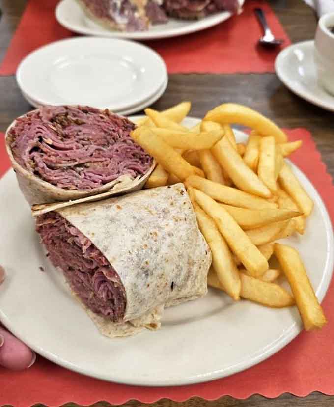 Even the gluten-free options get the royal treatment with generous pastrami and crispy golden fries.