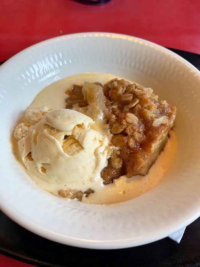 Warm apple crisp topped with vanilla ice cream melting into cinnamon-spiced fruit is the sweet ending barbecue deserves.