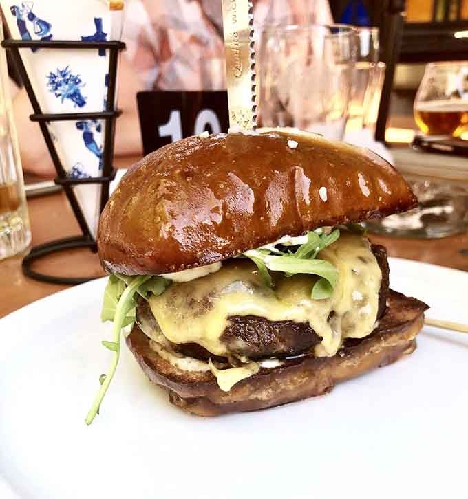 The Valley Farm Burger arrives stacked so high it defies the laws of physics and polite dinner conversation alike.