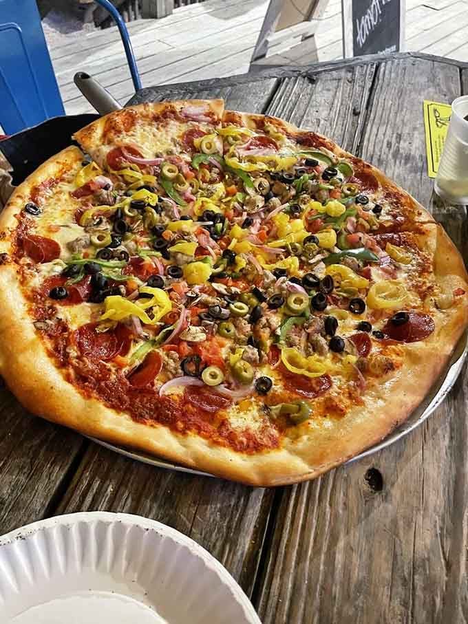 A pizza loaded with toppings that would make even the pickiest eater point and say "that one."