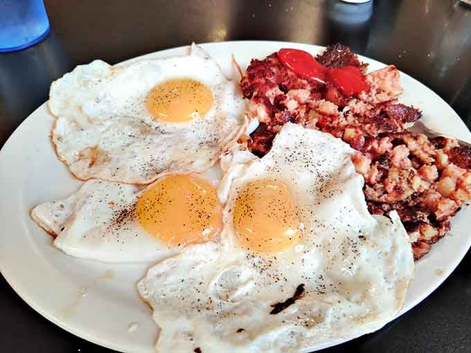 Three eggs and a mountain of corned beef hash make this the kind of plate that requires strategic planning.