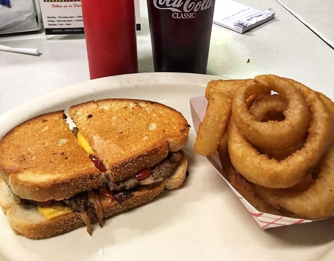 That patty melt on rye with a tower of onion rings is basically edible architecture.