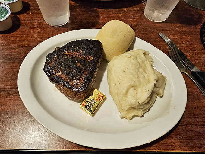 A perfectly cooked filet mignon with mashed potatoes proves small-town steakhouses can compete with anyone.