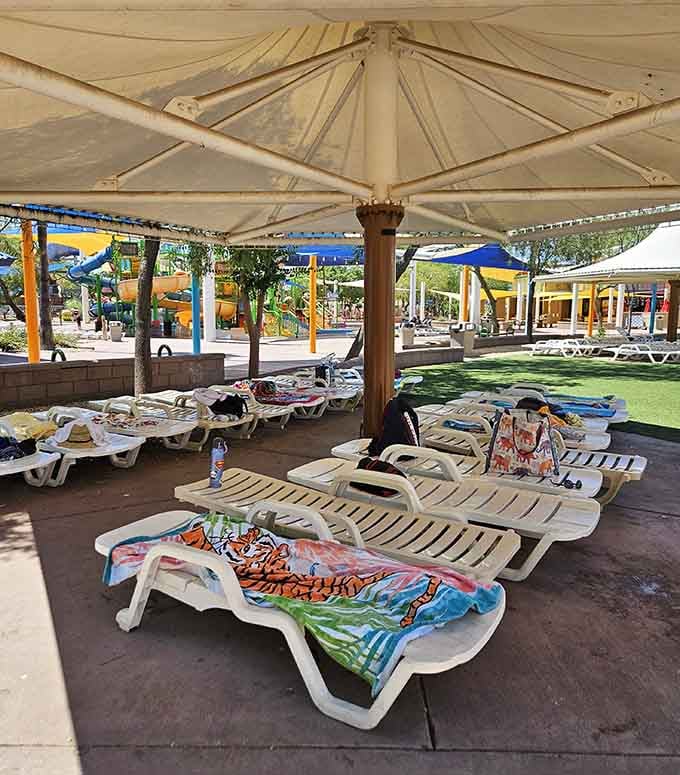 Prime real estate under the shade structures&mdash;stake your claim early or prepare to negotiate with sunburned strangers.