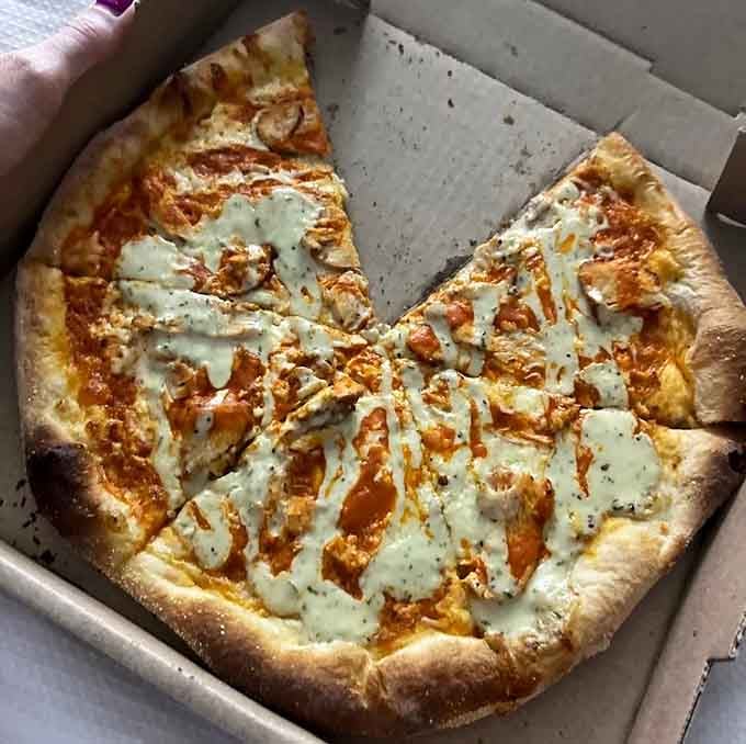 Buffalo Chicken pizza that delivers the heat without requiring you to sign a waiver or call your cardiologist.