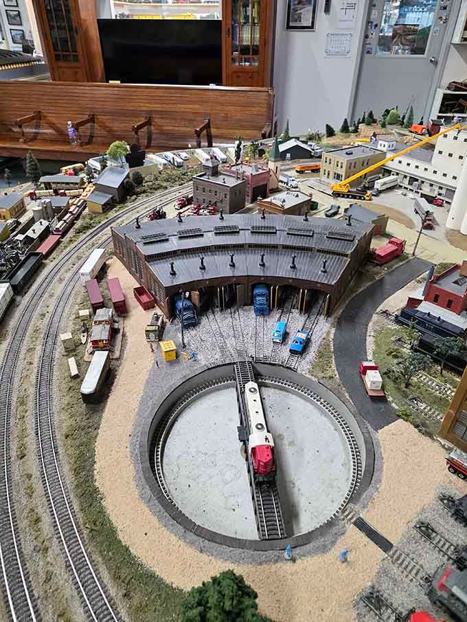 The roundhouse and turntable showcase the golden age of railroading when trains needed their own parking garages.