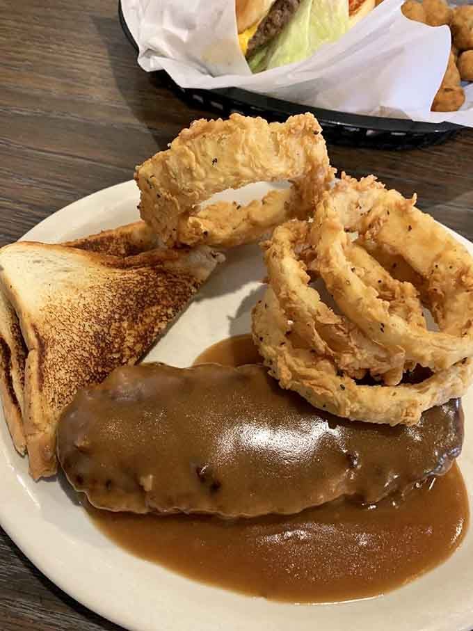 Hamburger steak smothered in brown gravy proves that comfort food doesn't need to apologize for being delicious.