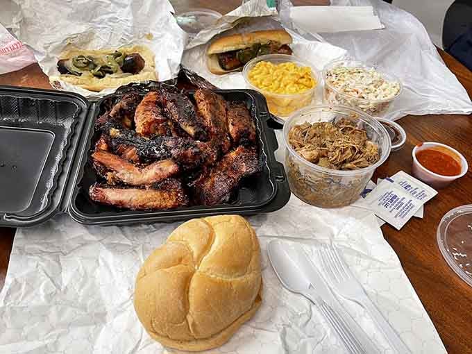 This is what happiness looks like on a picnic table: smoky ribs and sides worth the drive.