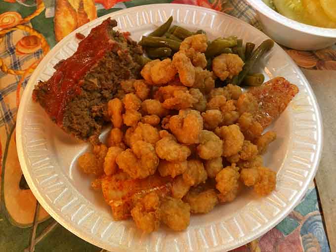 Calabash-style shrimp piled high like edible treasure, each one a tiny golden masterpiece begging to be devoured immediately.