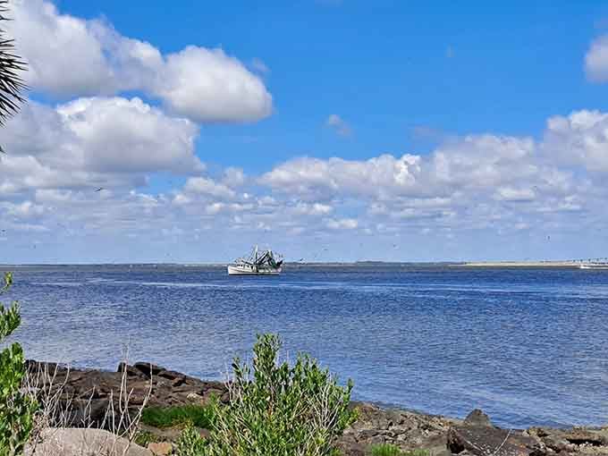 A local fishing boat still works these waters just like it has for generations, keeping the seafood scene honest.