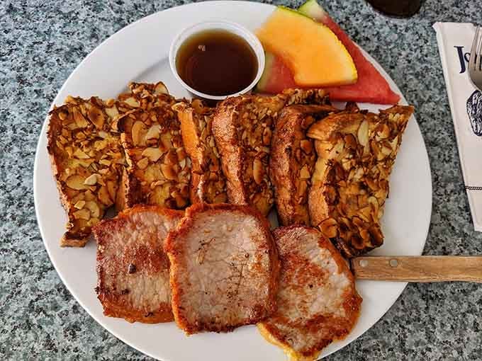 French toast topped with almonds and Canadian bacon proves breakfast can be both fancy and filling.