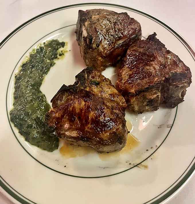Three perfectly grilled lamb chops with creamed spinach, because sometimes you need to venture beyond beef and live a little.