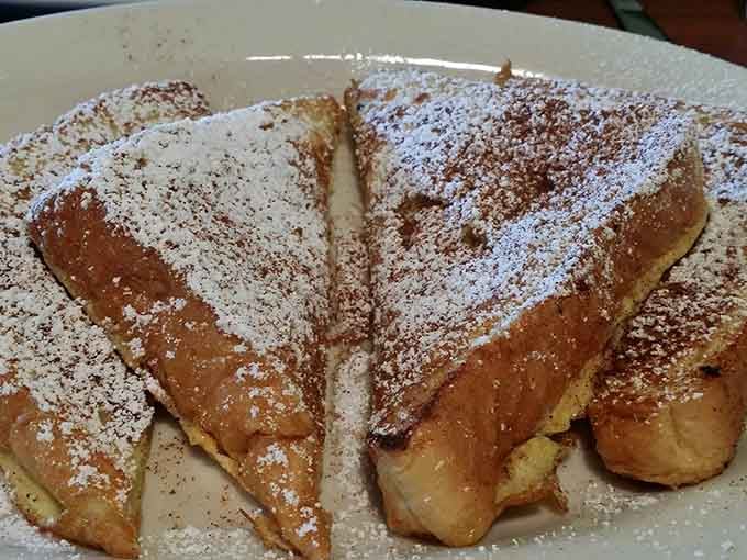 French toast dusted with powdered sugar like fresh Alabama snow, cinnamon-kissed and absolutely irresistible.
