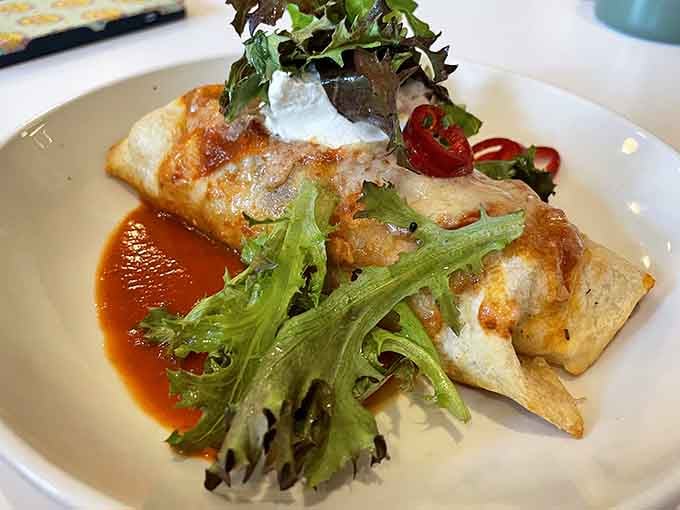 That golden breakfast burrito with fresh greens looks like it could solve all your morning problems in one delicious package.