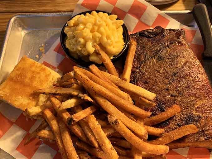Half rack of pork ribs with mac and cheese that'll have you reconsidering every life choice that didn't involve barbecue.