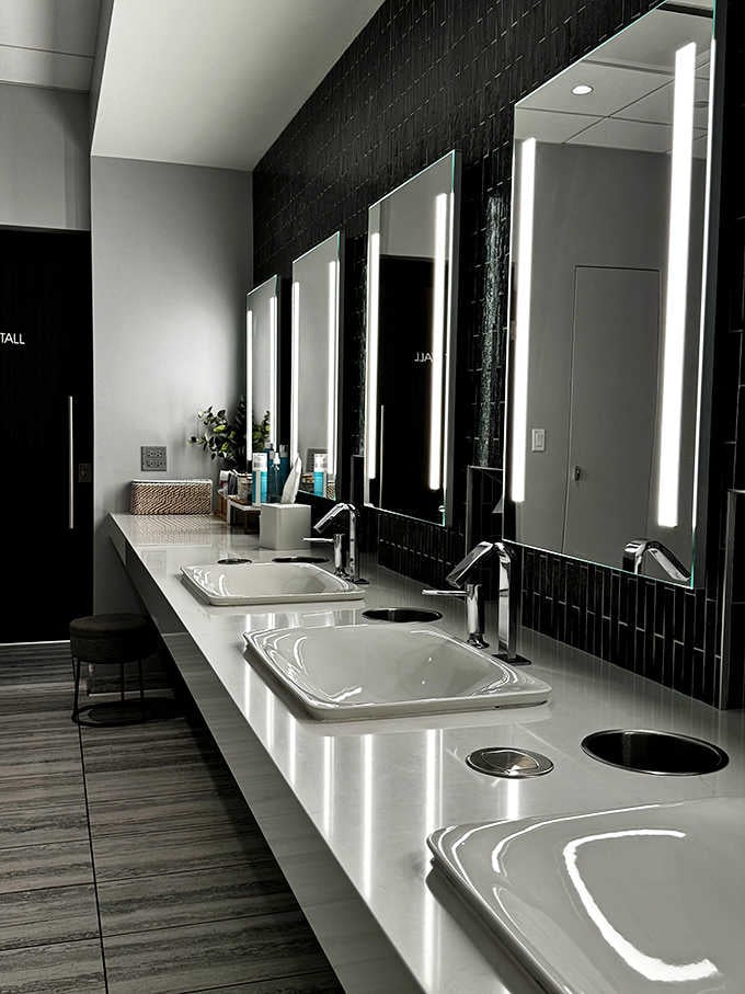Hollywood-style mirrors and pristine counters transform your pre-treatment routine into a glamorous affair worth savoring.