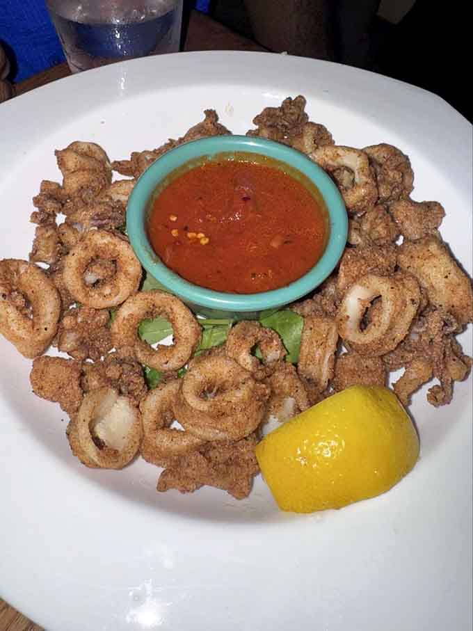 Perfectly fried calamari that proves some classics never need updating, just proper execution and marinara sauce.