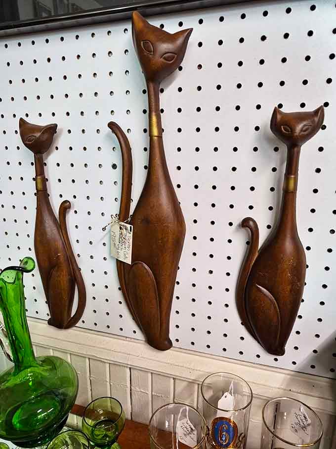 These mid-century wooden cats have more personality than most people's entire living room, and they never need feeding.