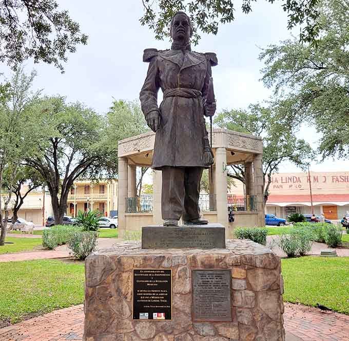 This monument stands proud in the plaza, honoring history while locals go about their daily business all around it.