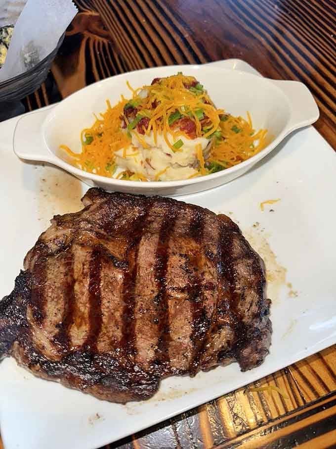 That ribeye with loaded mashed potatoes is the kind of plate that makes you forget your own name temporarily.