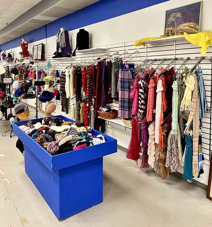 Scarves, hats, and accessories hang like a textile rainbow ready to complete any outfit for pennies.