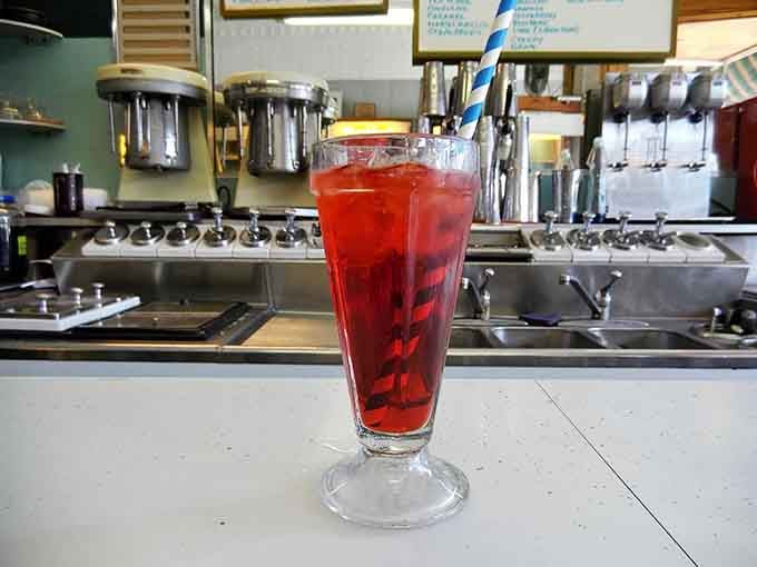 Cherry-red and fizzing with possibility, this phosphate is what happiness looks like when it's served in a glass.
