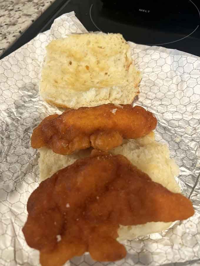 Golden fried chicken nestled in a buttery biscuit, because sometimes breakfast needs to be an over-the-top celebration.