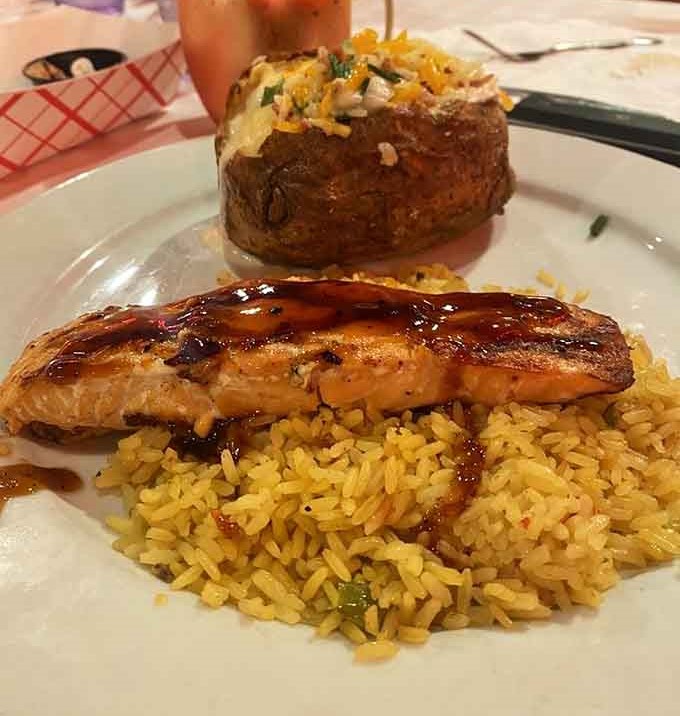 Grilled salmon glazed to perfection, proving this chophouse knows its way around more than just beef.