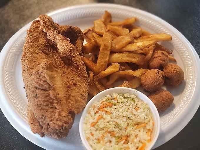 Perfectly seasoned catfish with hush puppies and slaw&mdash;this is what fishing trips were invented to justify eating.