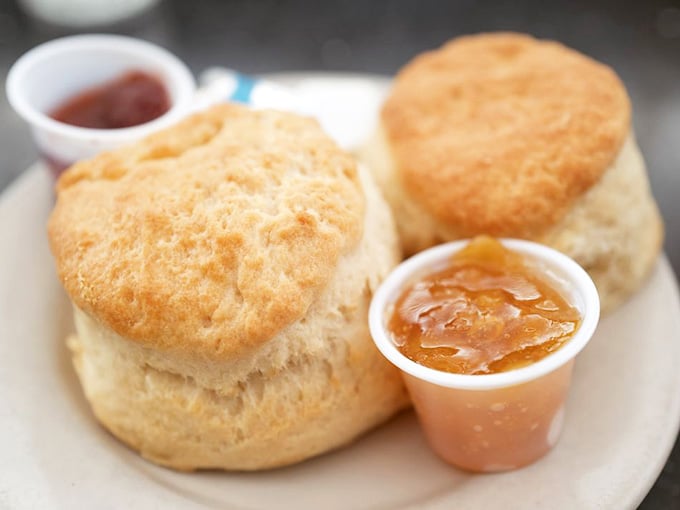 Biscuits so tall and fluffy they could apply for their own zip code in carbohydrate heaven.