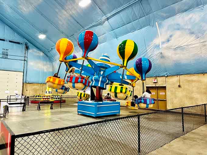 Carnival rides indoors because why should waterparks have all the fun when you can add spinning balloons too?