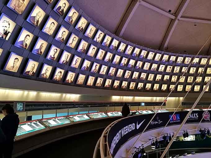 Hundreds of Hall of Fame portraits curve overhead, creating a constellation of basketball's brightest stars through the decades.