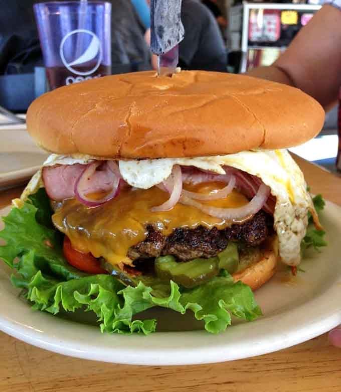 This burger tower has more levels than a parking garage and requires approximately the same amount of engineering to consume.