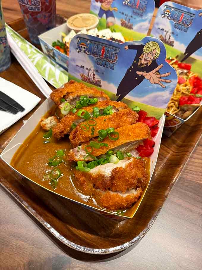 Crispy panko-crusted chicken swimming in curry sauce proves Sanji's cooking skills translate beautifully to real life dining.