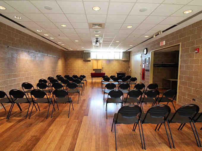 Even conservatories need meeting spaces, though the view beats any corporate conference room you've seen.