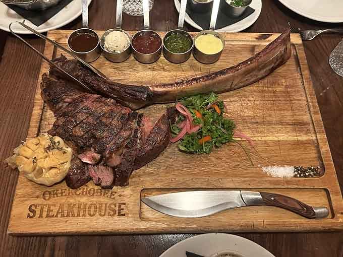The tomahawk arrives on a wooden board with sauce options, making you feel like royalty at a medieval feast.