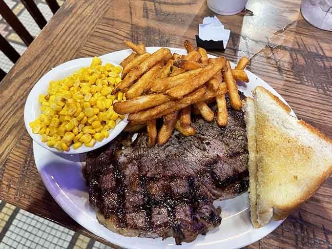 That perfectly charred ribeye with corn and fries is what happens when Texas takes steak seriously, which is always.
