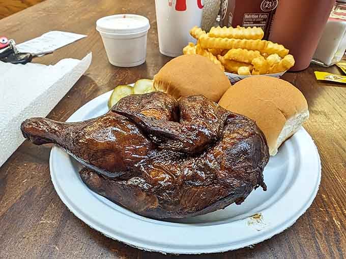 Golden-brown chicken with crinkle fries and soft buns on a white plate, comfort food at its finest glory.