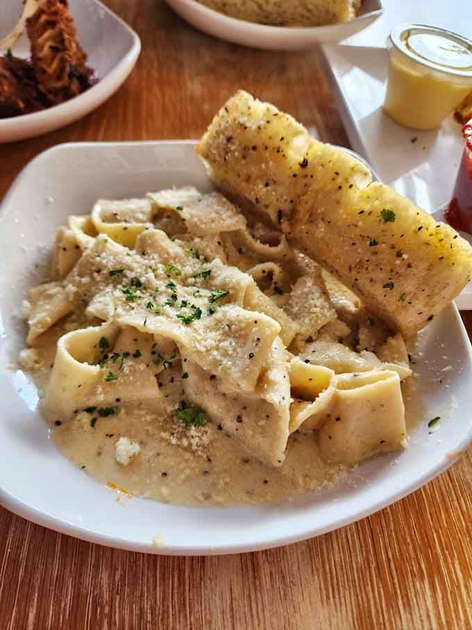 Cacio e pepe done right: simple ingredients creating the kind of creamy perfection that haunts your dreams.