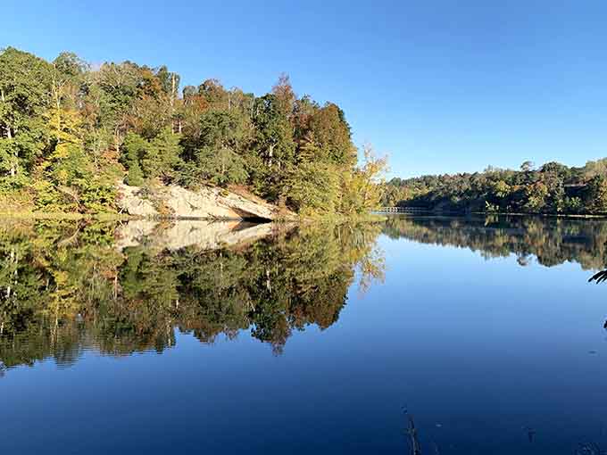 Fall foliage reflected in mirror-still water creates the kind of scene that makes photographers weep with joy.
