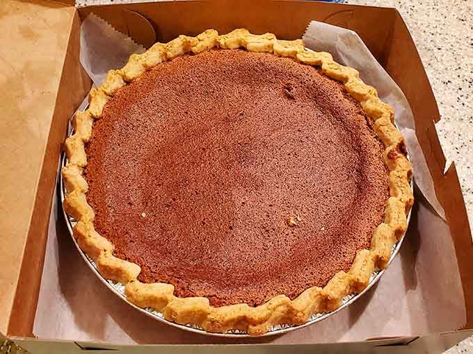 Chocolate pie with that silky smooth top, proving simplicity done right beats fancy every single time.