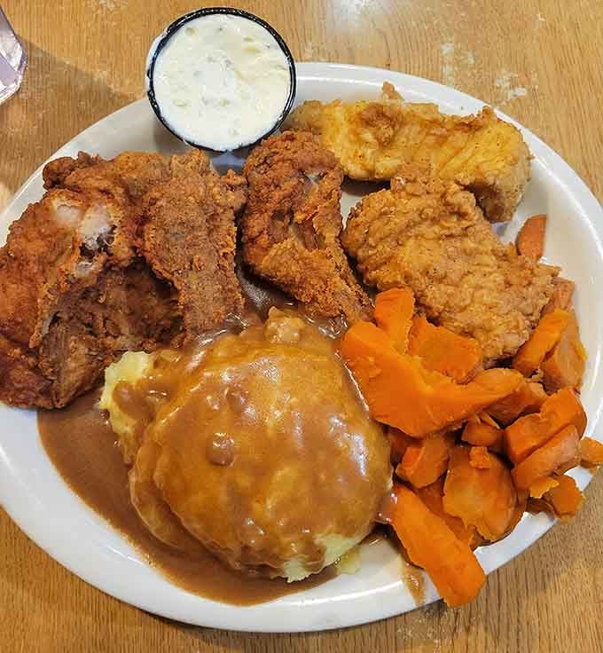 Golden fried chicken with all the fixings&mdash;this is the kind of plate that makes you understand why comfort food exists.