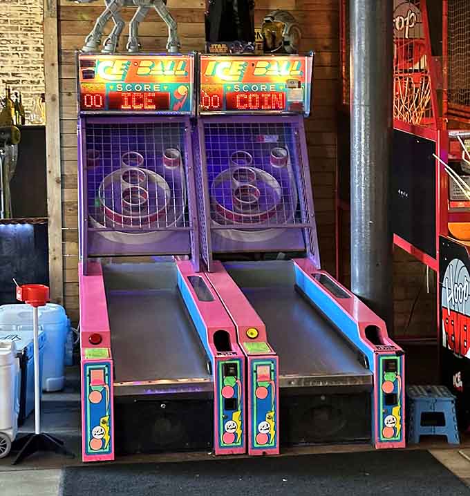 Skee-Ball lanes lined up like soldiers, ready to reward your perfect roll with that satisfying clatter of tickets.