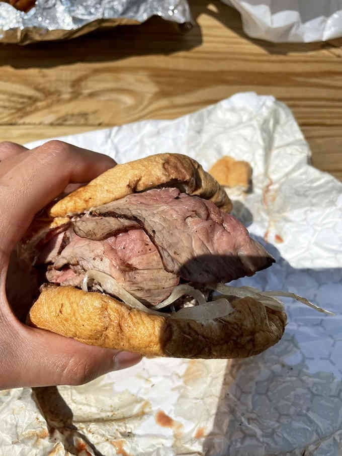 Layers of charcoal-grilled perfection that would make any sandwich architect weep with joy.