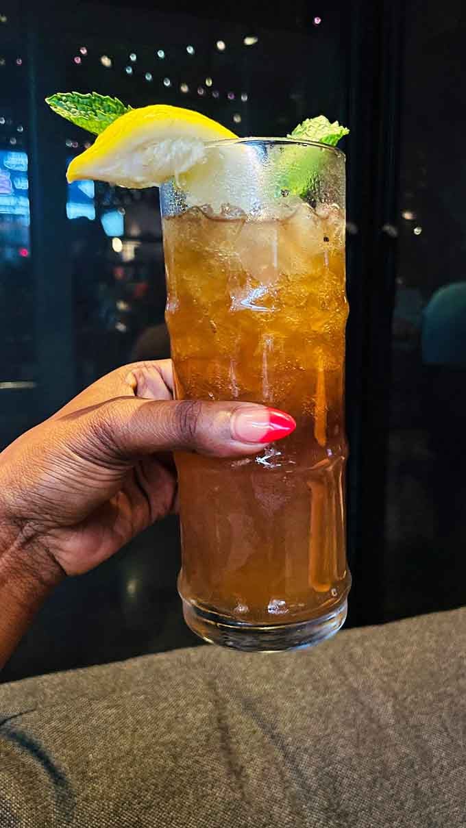 Refreshment served tall with a lemon wedge and mint, because hydration counts even during competitive putting.