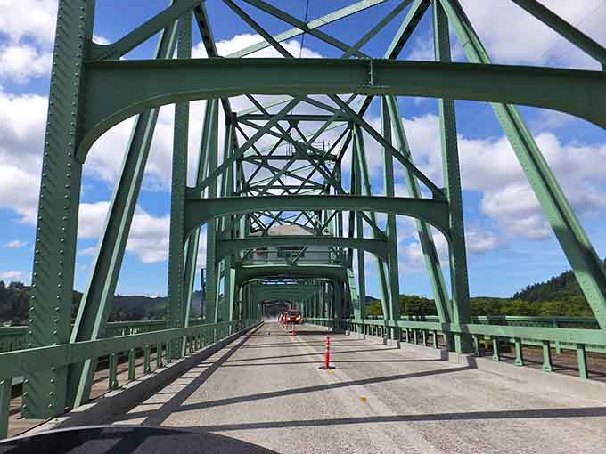 The green steel bridge spans the Umpqua River with geometric precision that would make an engineer weep with joy.