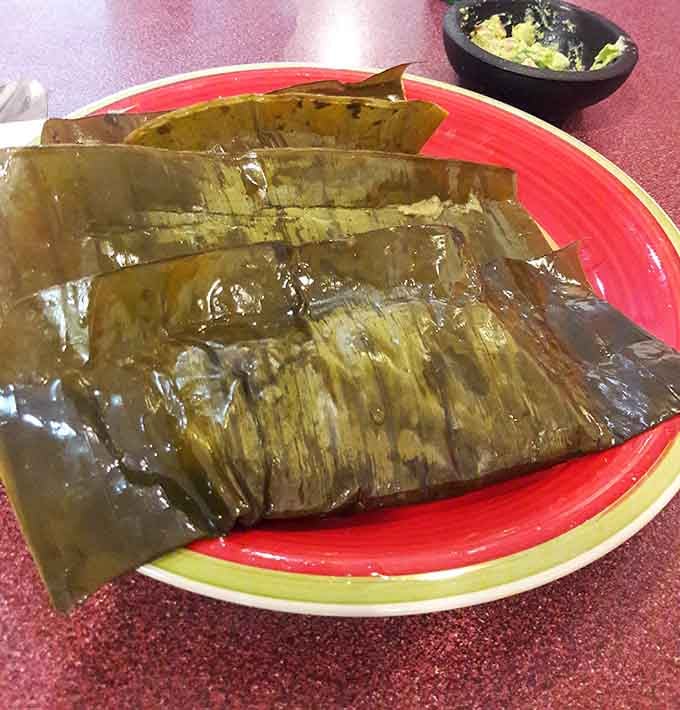 Tamales wrapped in banana leaves are traditional comfort food that transcends all cultural boundaries and empty stomachs.