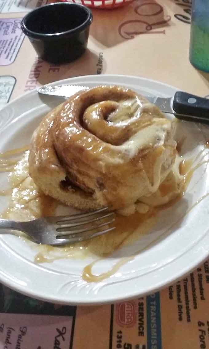 This cinnamon roll could double as a throw pillow, and honestly, that glaze deserves its own fan club.