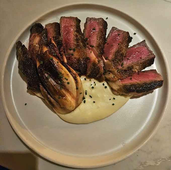 A perfectly seared ribeye that would make any cowboy hang up their spurs and stay awhile.