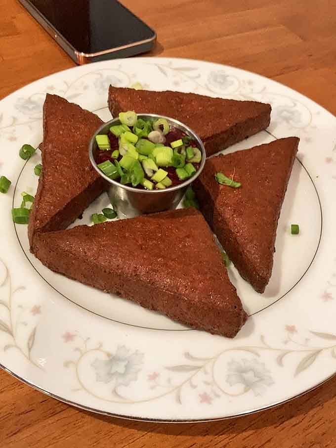Fried Cheese triangles with dipping sauce: Wisconsin's dairy heritage meets crispy, golden perfection in every bite.